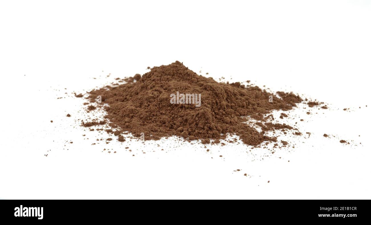 Pile cocoa powder isolated on white background Stock Photo - Alamy
