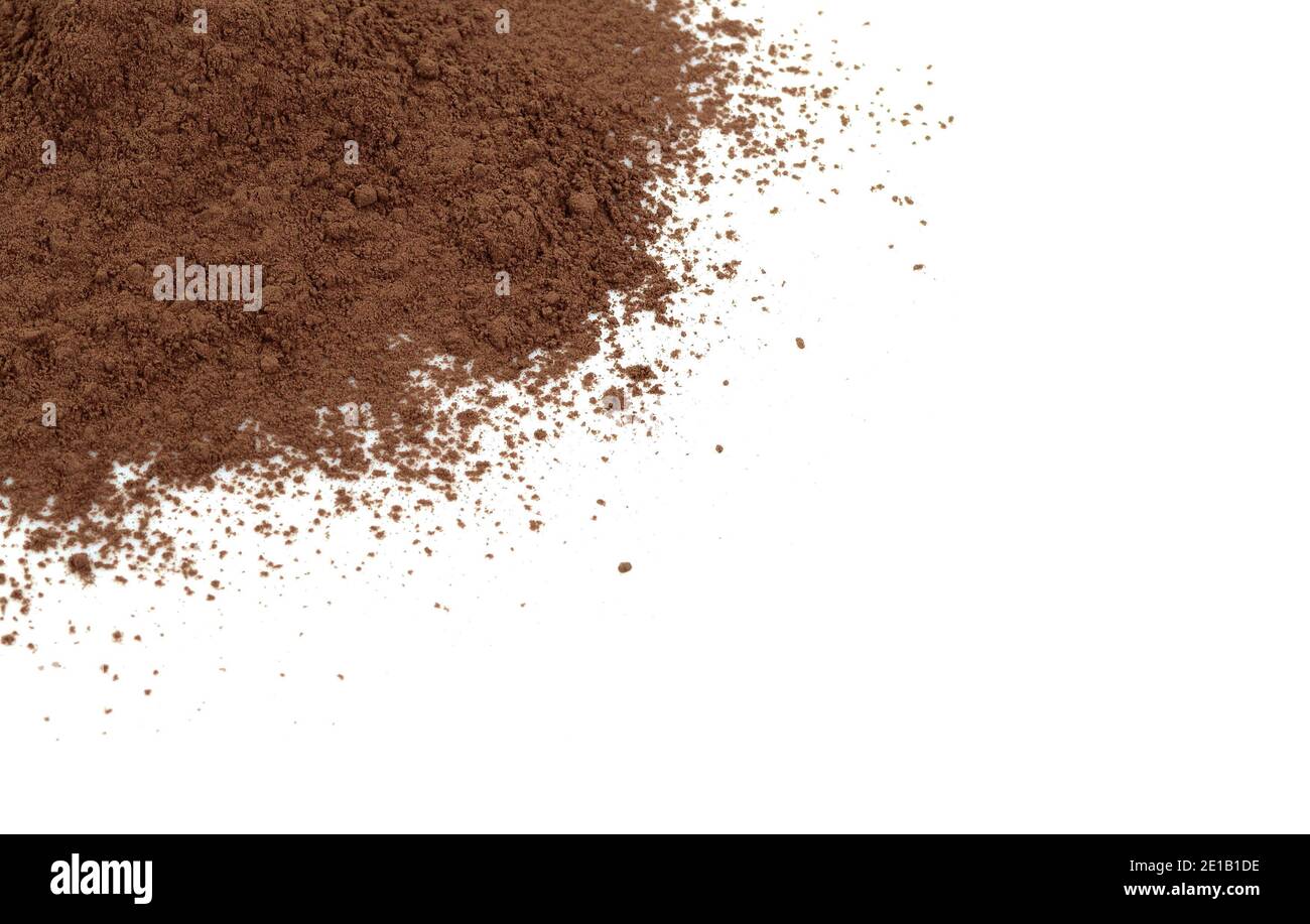 Pile cocoa powder isolated on white background Stock Photo - Alamy