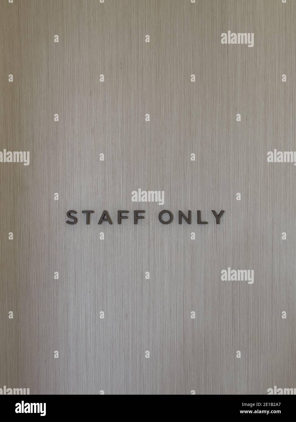 Staff only word on empty wall background, stock photo Stock Photo - Alamy