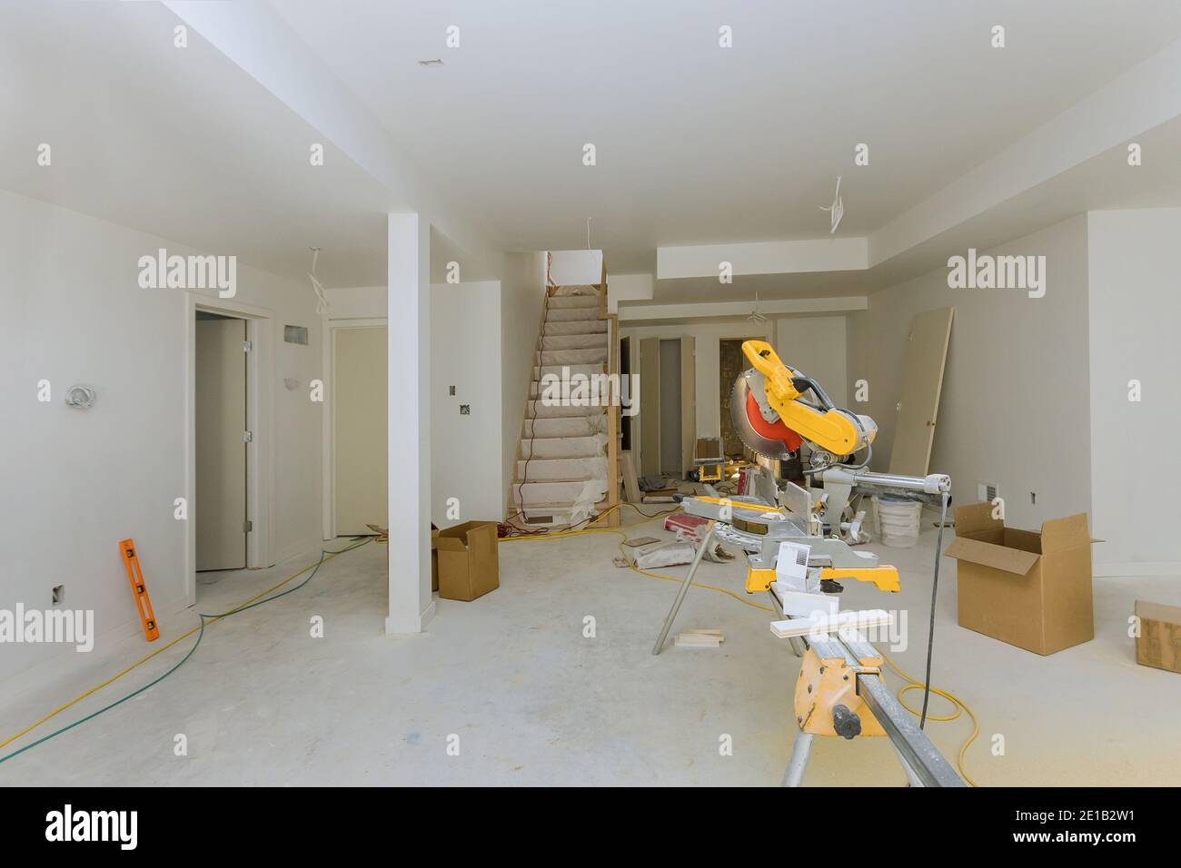 Construction remodeling home with close up of circular saw cutting wood ...