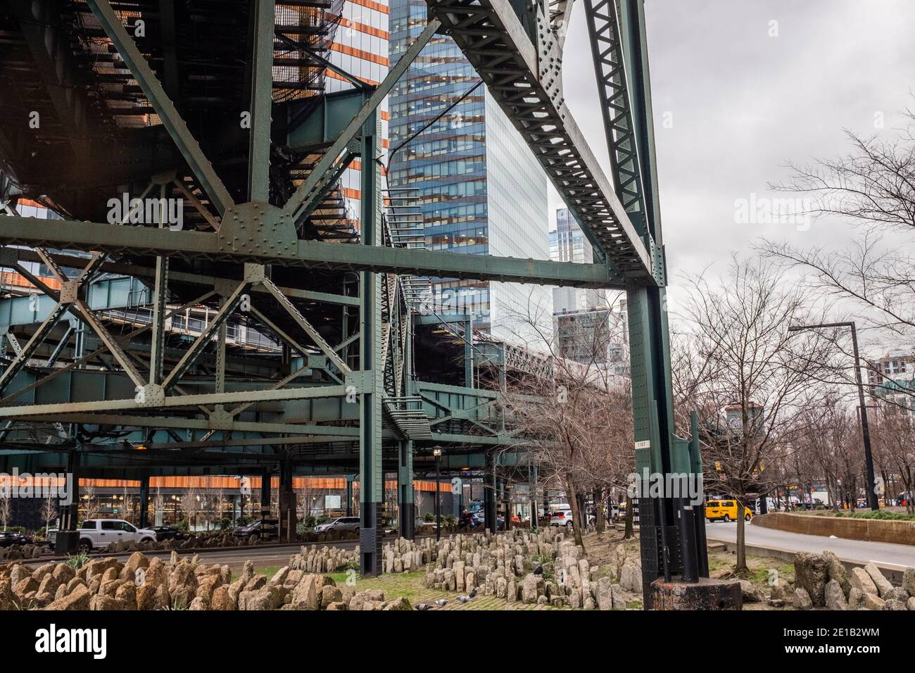 Elevated trains in between buildings Stock Photo - Alamy