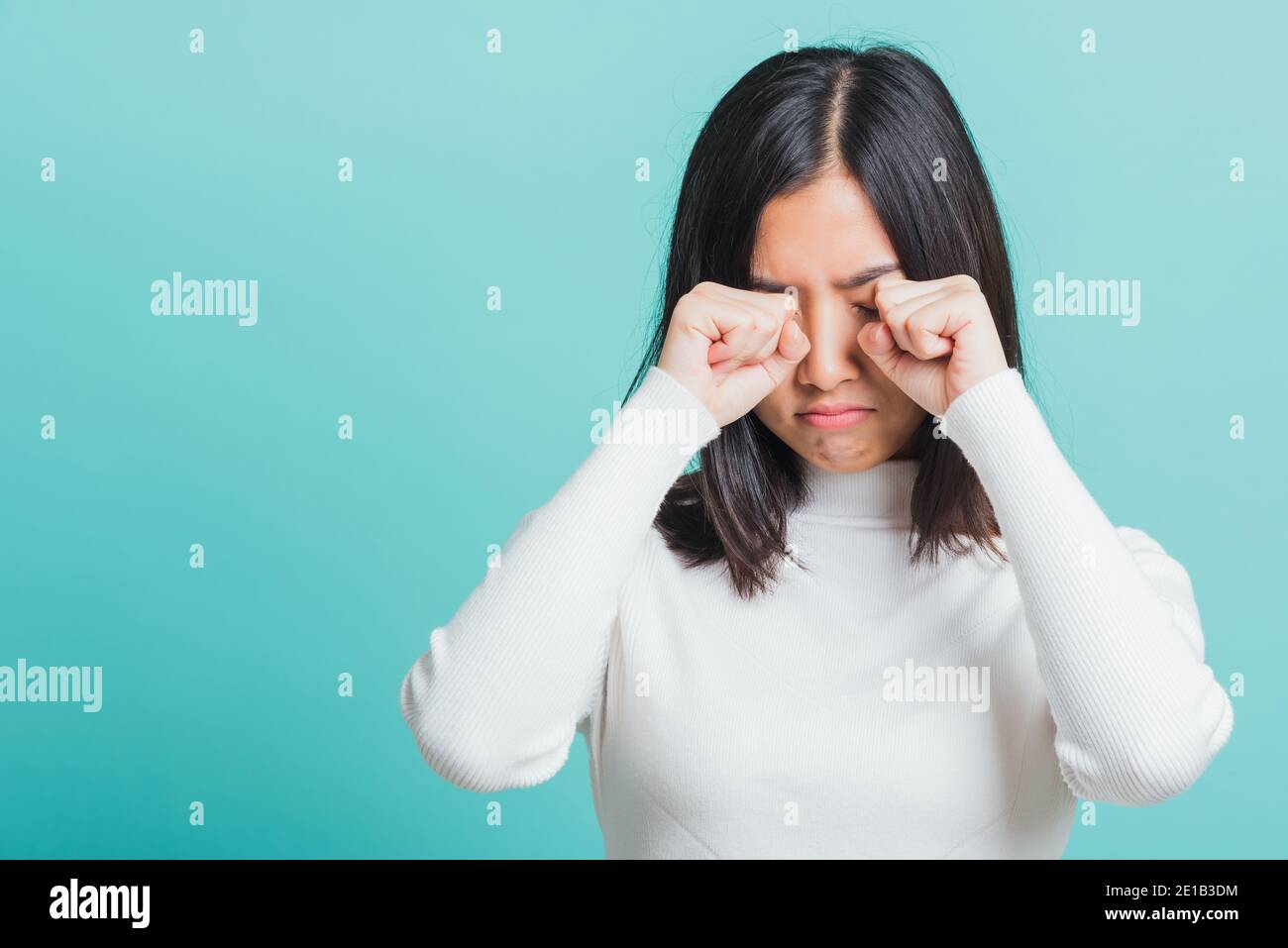 Young asian woman crying while wiping tears hi-res stock photography ...
