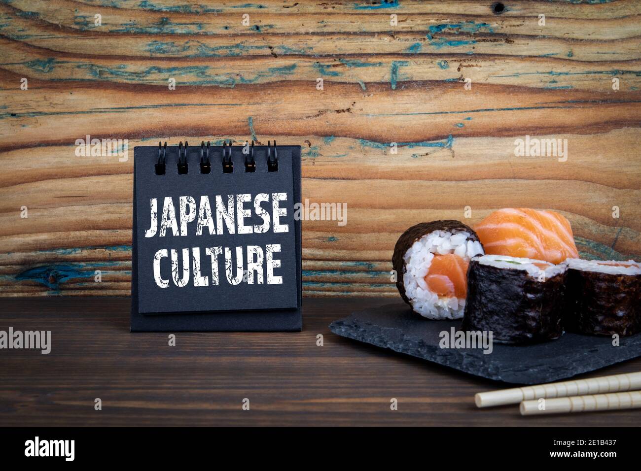 Japanese Culture. Notebook and sushi on wooden texture table Stock ...