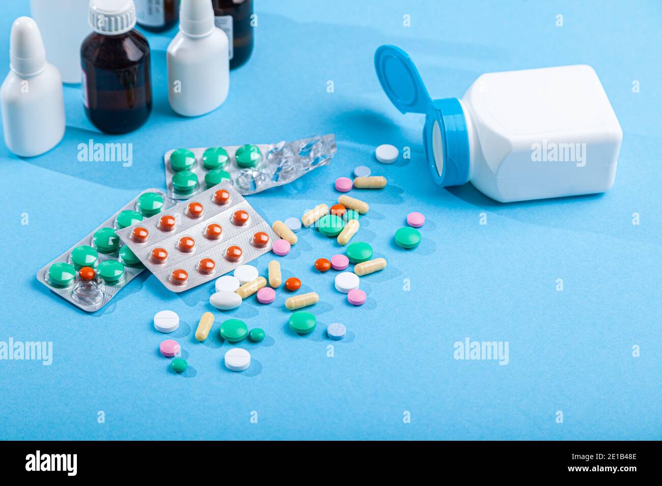 Different medical medicines, thermometer, syringe, spray, bottles of ...