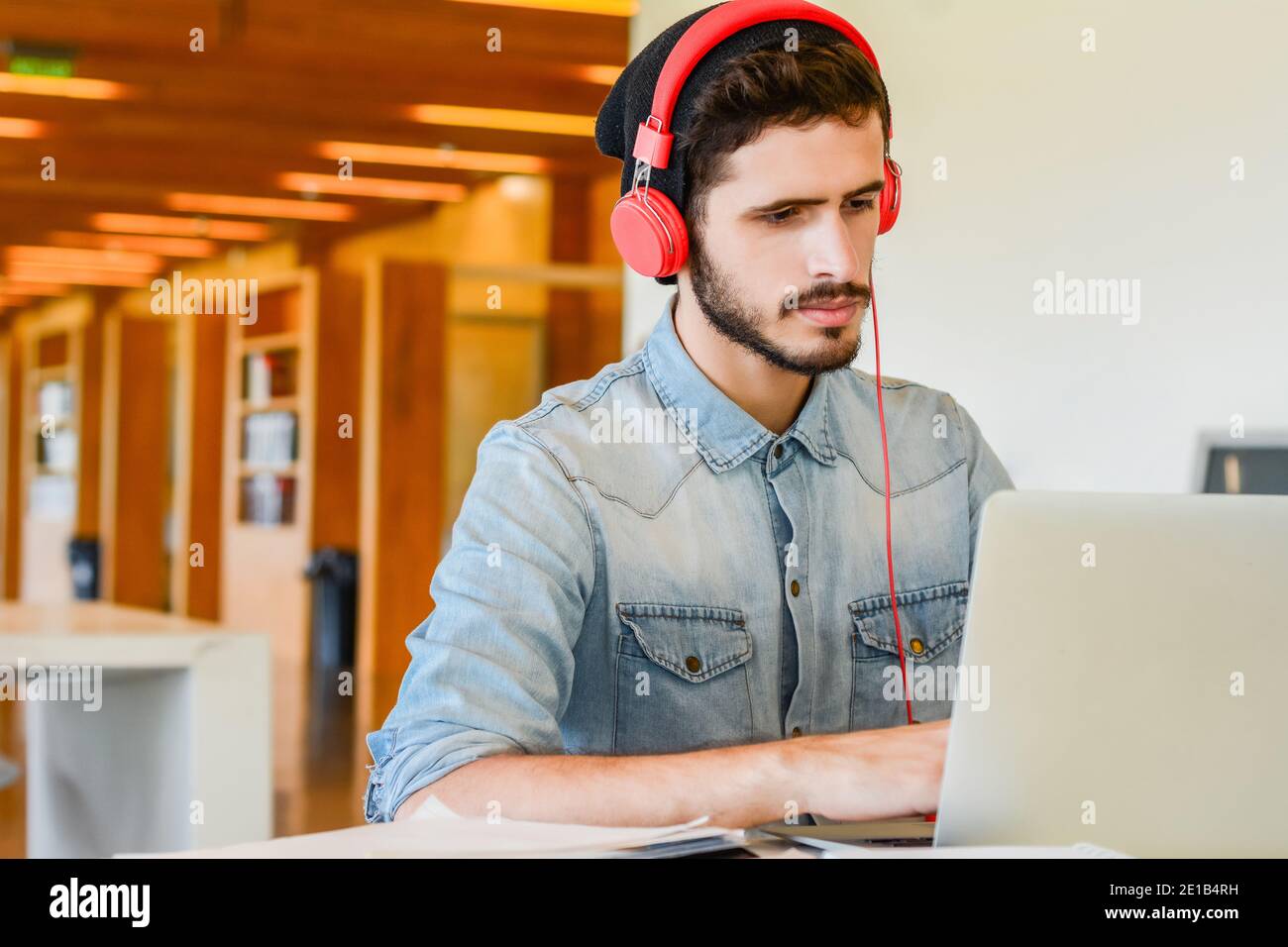 Young male student studying at university campus Stock Photo - Alamy