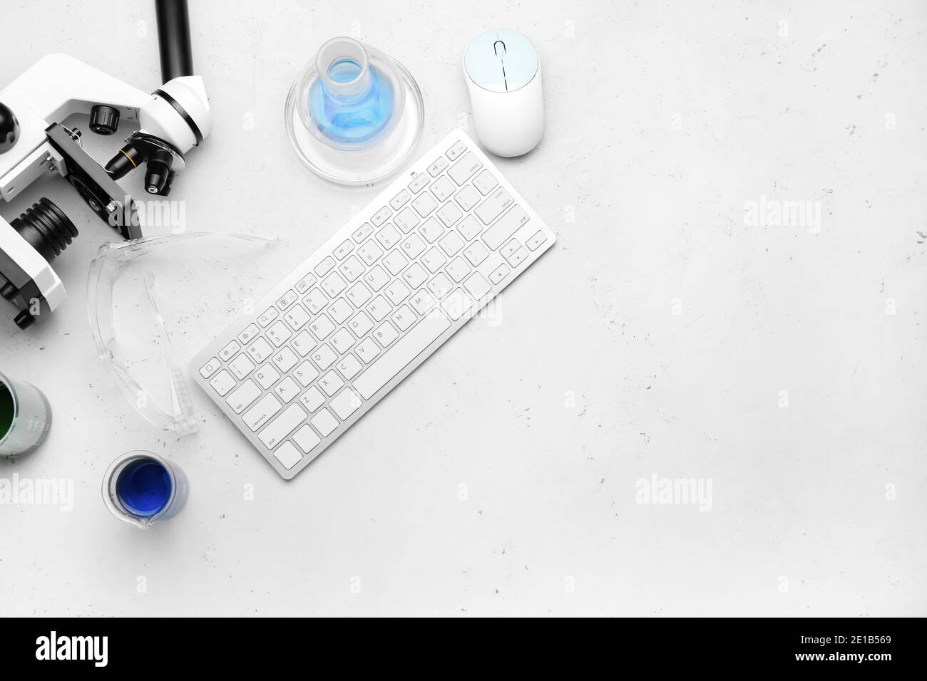 Computer keyboard, mouse and microscope on light background Stock Photo ...
