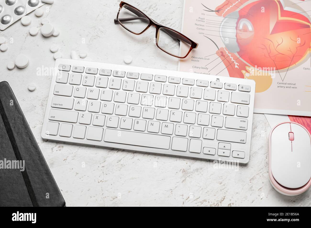 Computer keyboard, mouse and drawing scheme of human eye on light ...