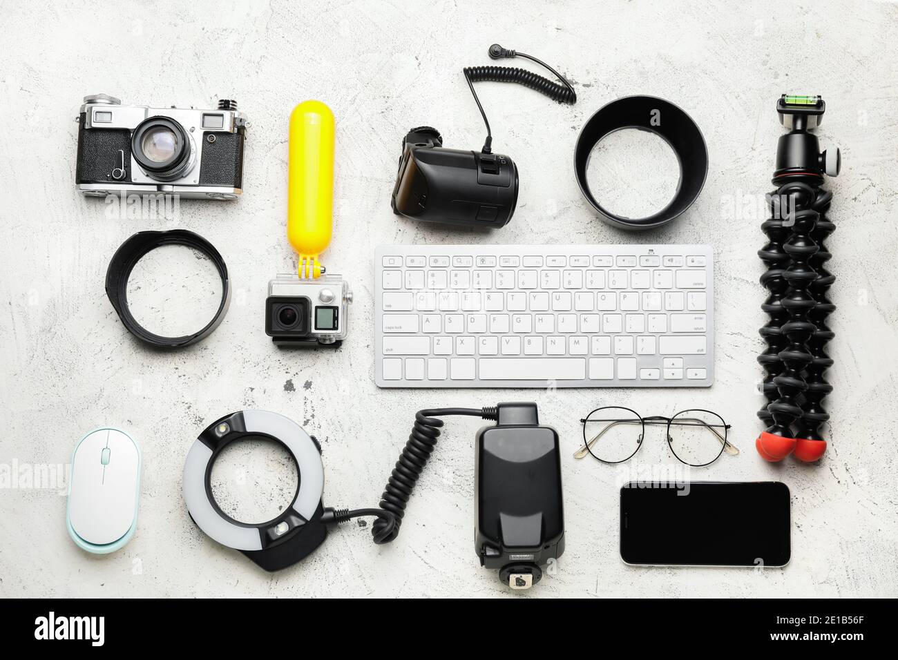 Composition with modern photographer's equipment and computer keyboard ...