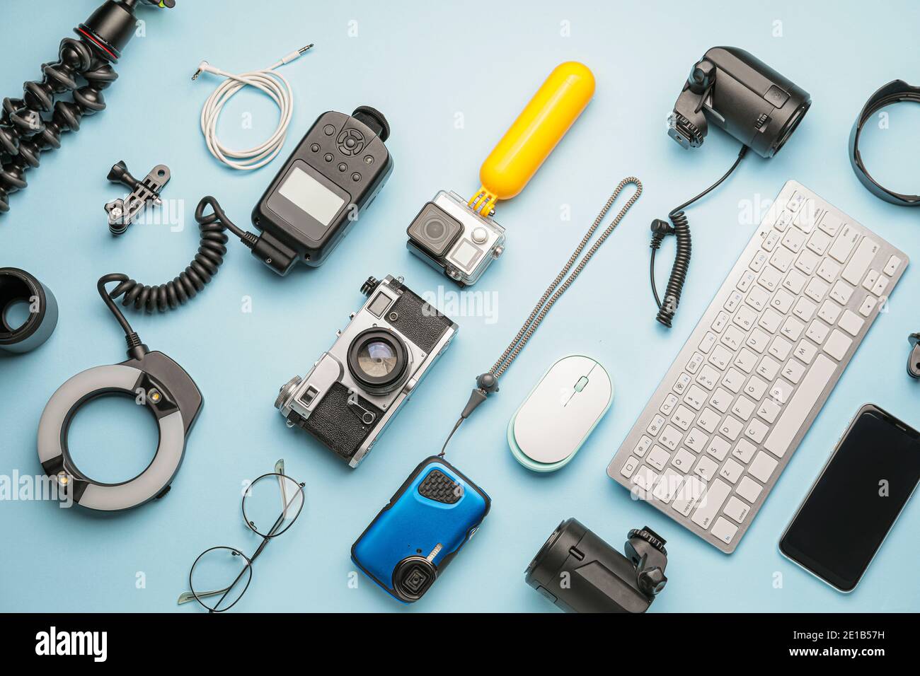 Composition of modern photographer's equipment and computer keyboard on ...