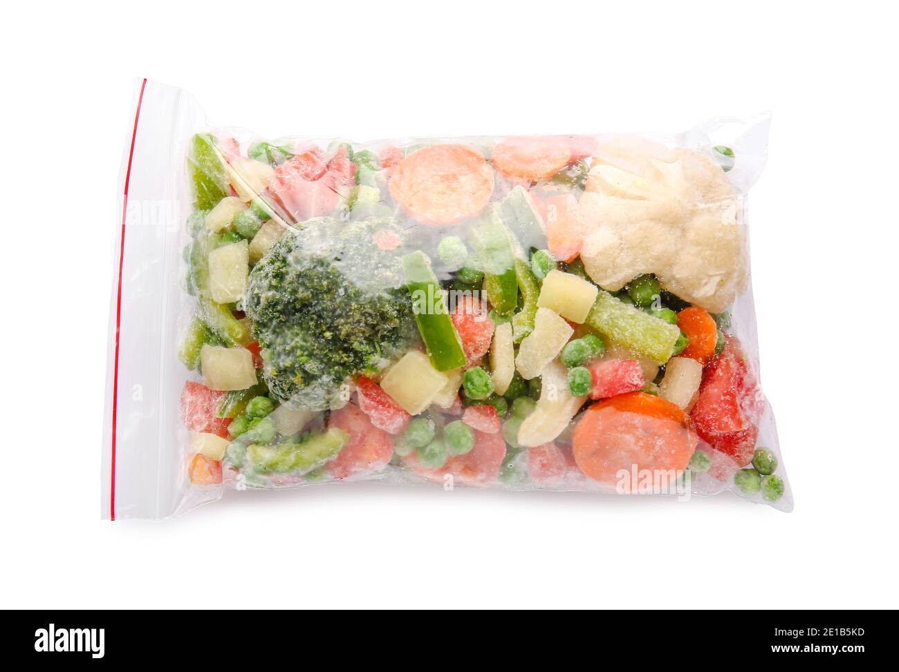 Frozen vegetables in plastic bag on white background Stock Photo - Alamy