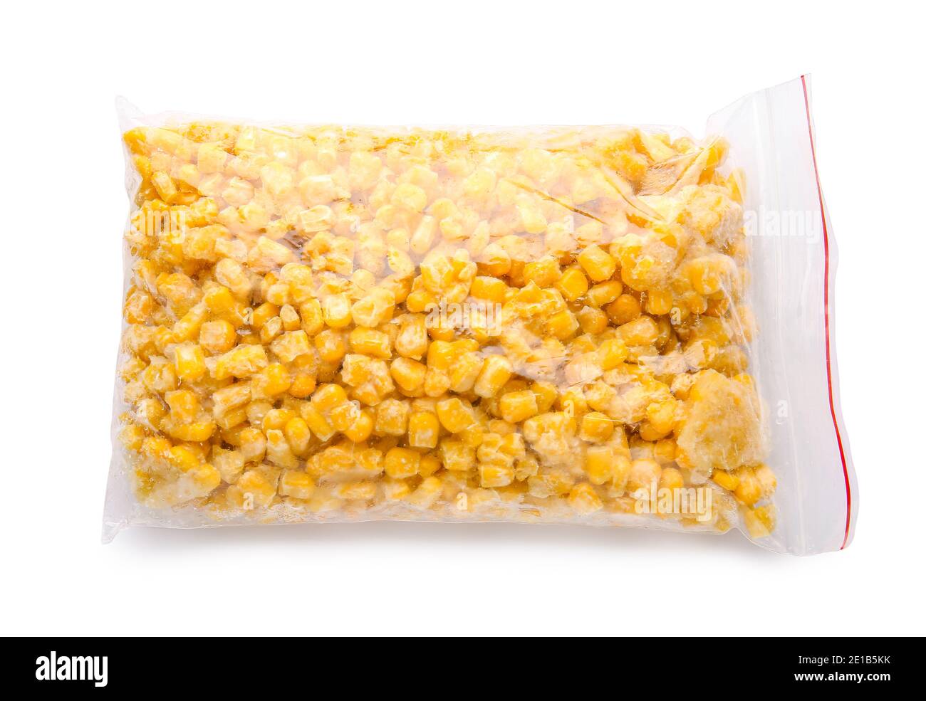 Frozen corn in plastic bag on white background Stock Photo - Alamy