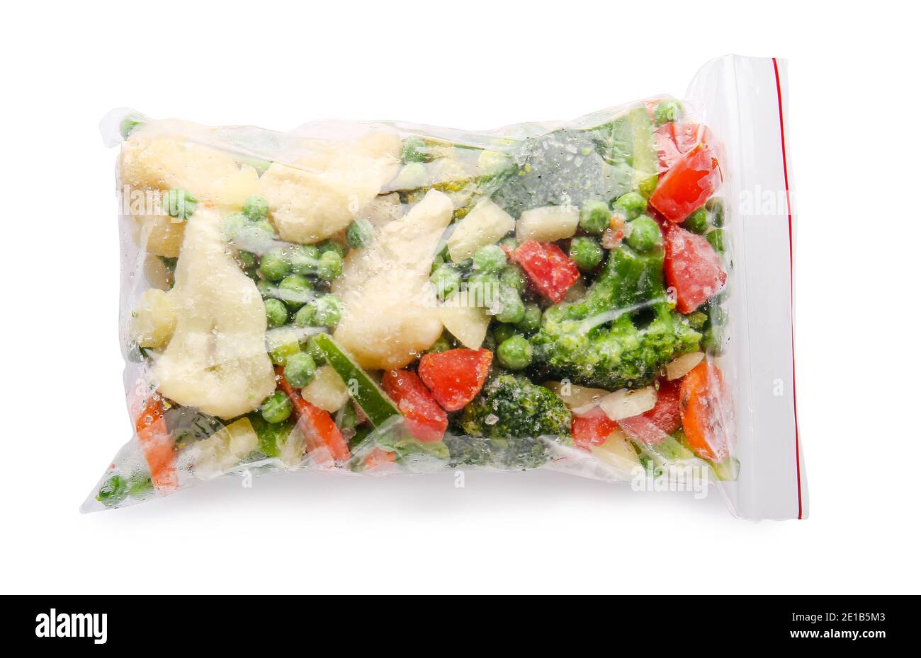 Frozen vegetables in plastic bag on white background Stock Photo - Alamy