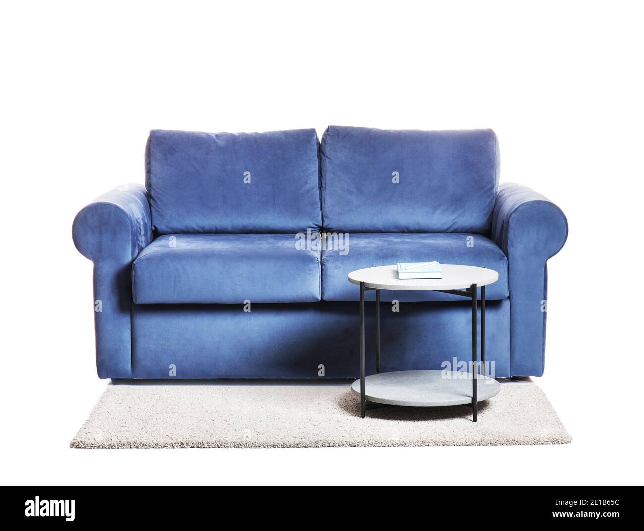 Stylish sofa and table on white background Stock Photo - Alamy