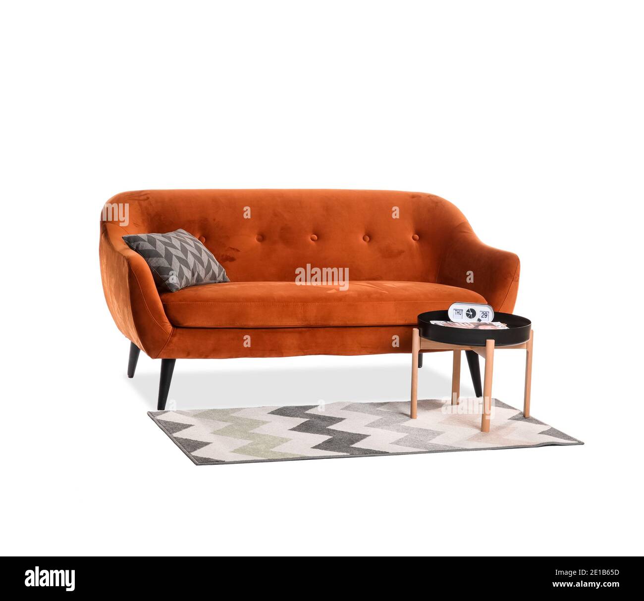 Stylish sofa and table on white background Stock Photo - Alamy