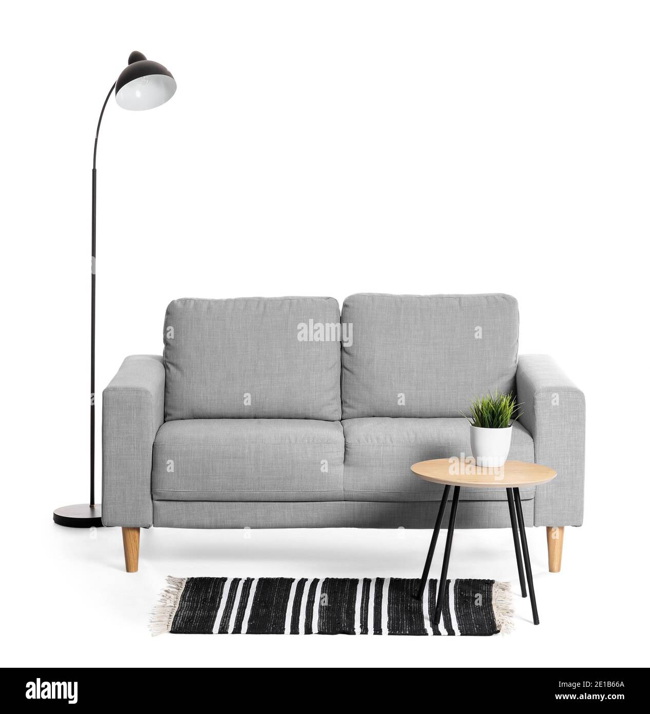 Stylish sofa and table on white background Stock Photo - Alamy