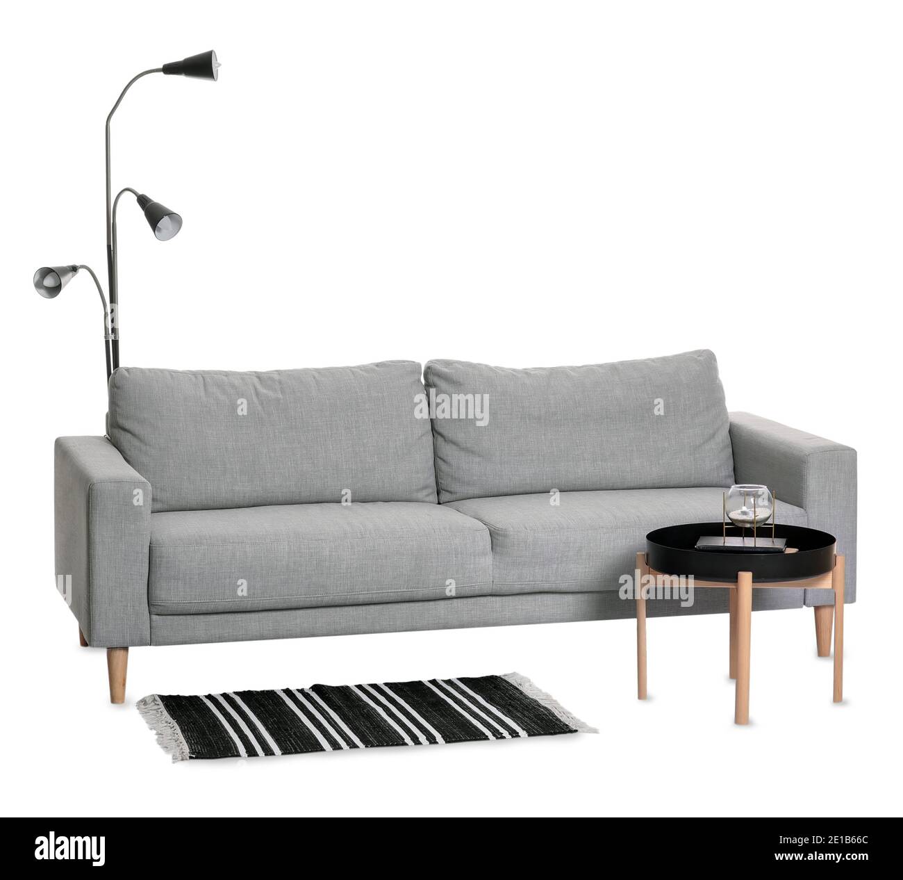 Stylish sofa and table on white background Stock Photo - Alamy