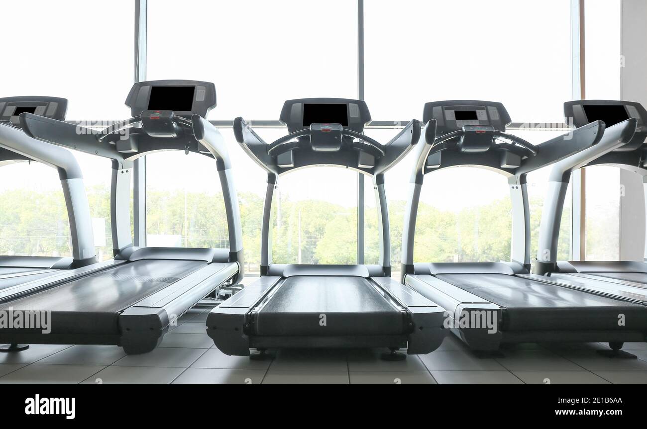 Interior of modern gym with treadmills Stock Photo - Alamy