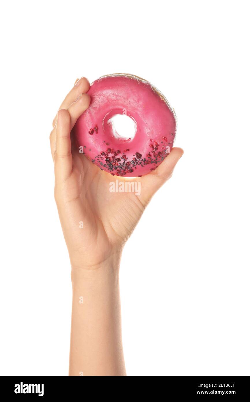 Hand with sweet donut on white background Stock Photo - Alamy