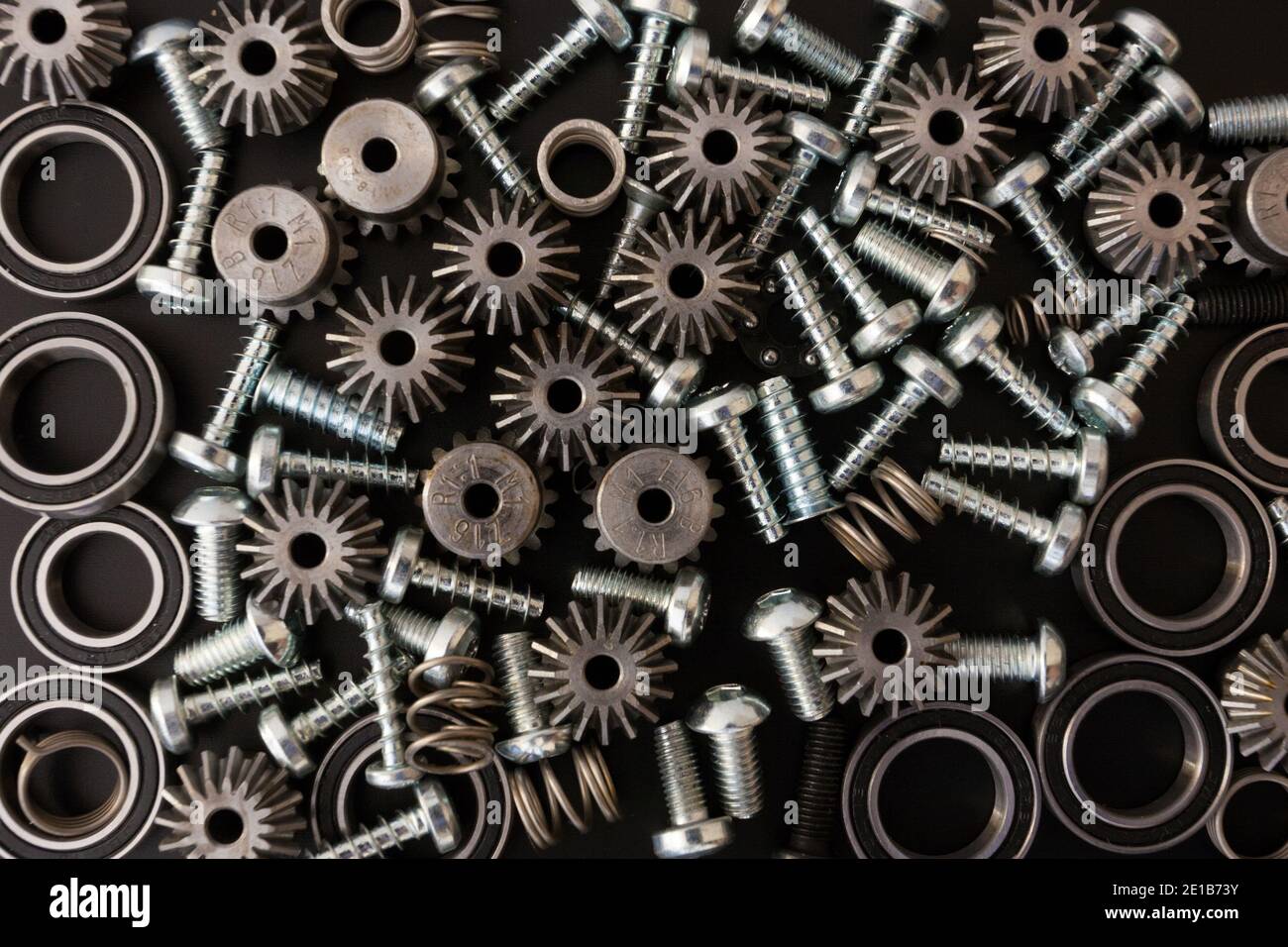 Background with mechanical components, gears, springs, screws ...