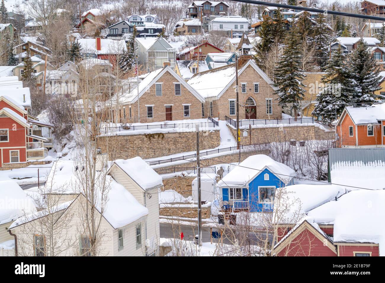 Residential community in the mountains with a church building amidst ...