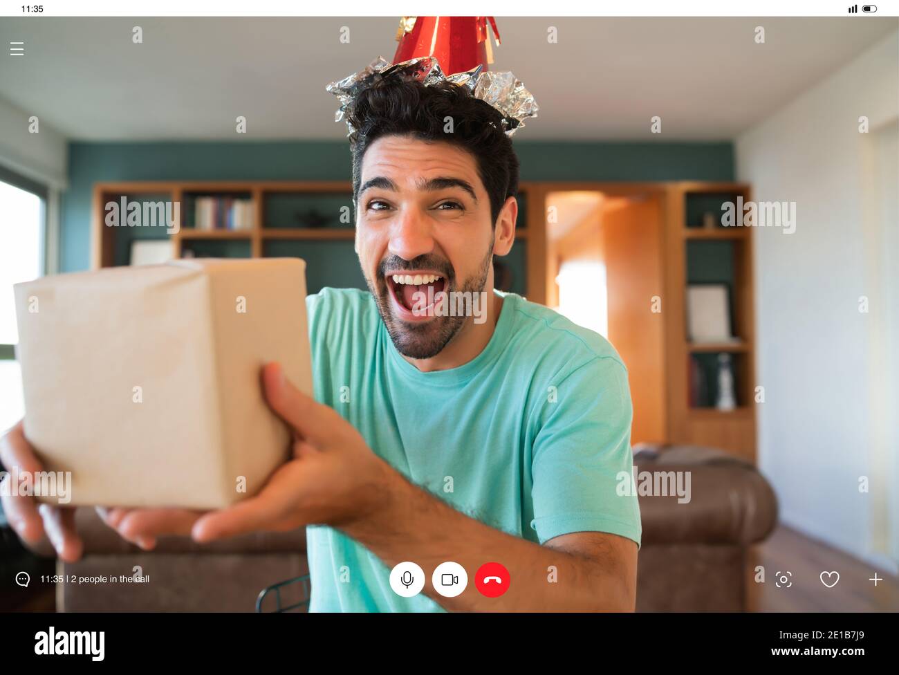 Man celebrating his birthday on a video call Stock Photo - Alamy