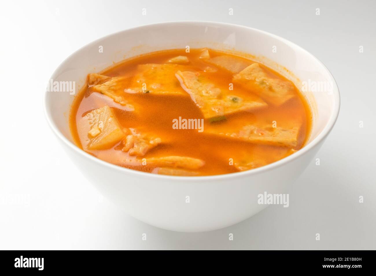 Fish cake soup on a white background Stock Photo - Alamy
