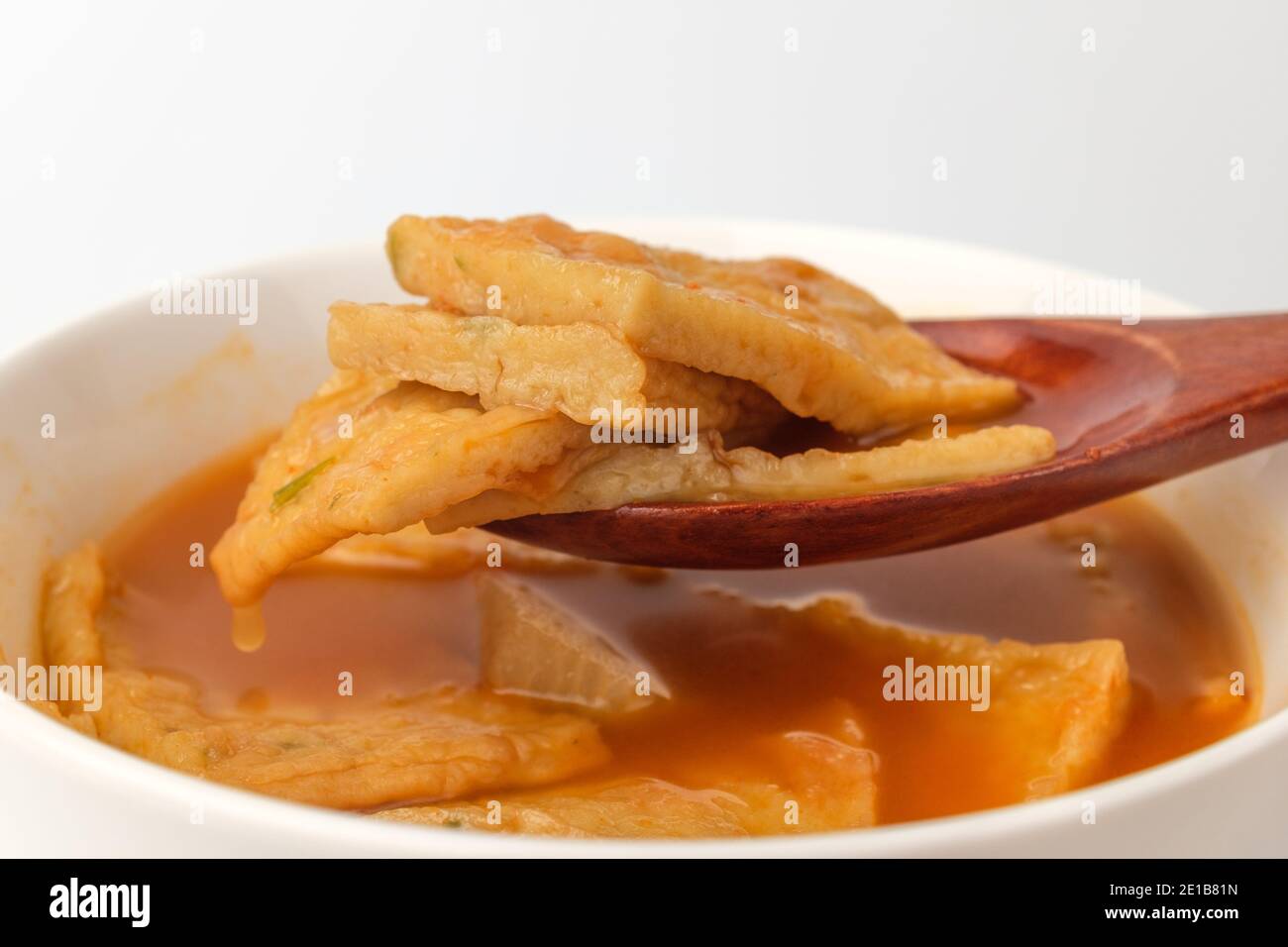 Fish cake soup on a white background Stock Photo - Alamy