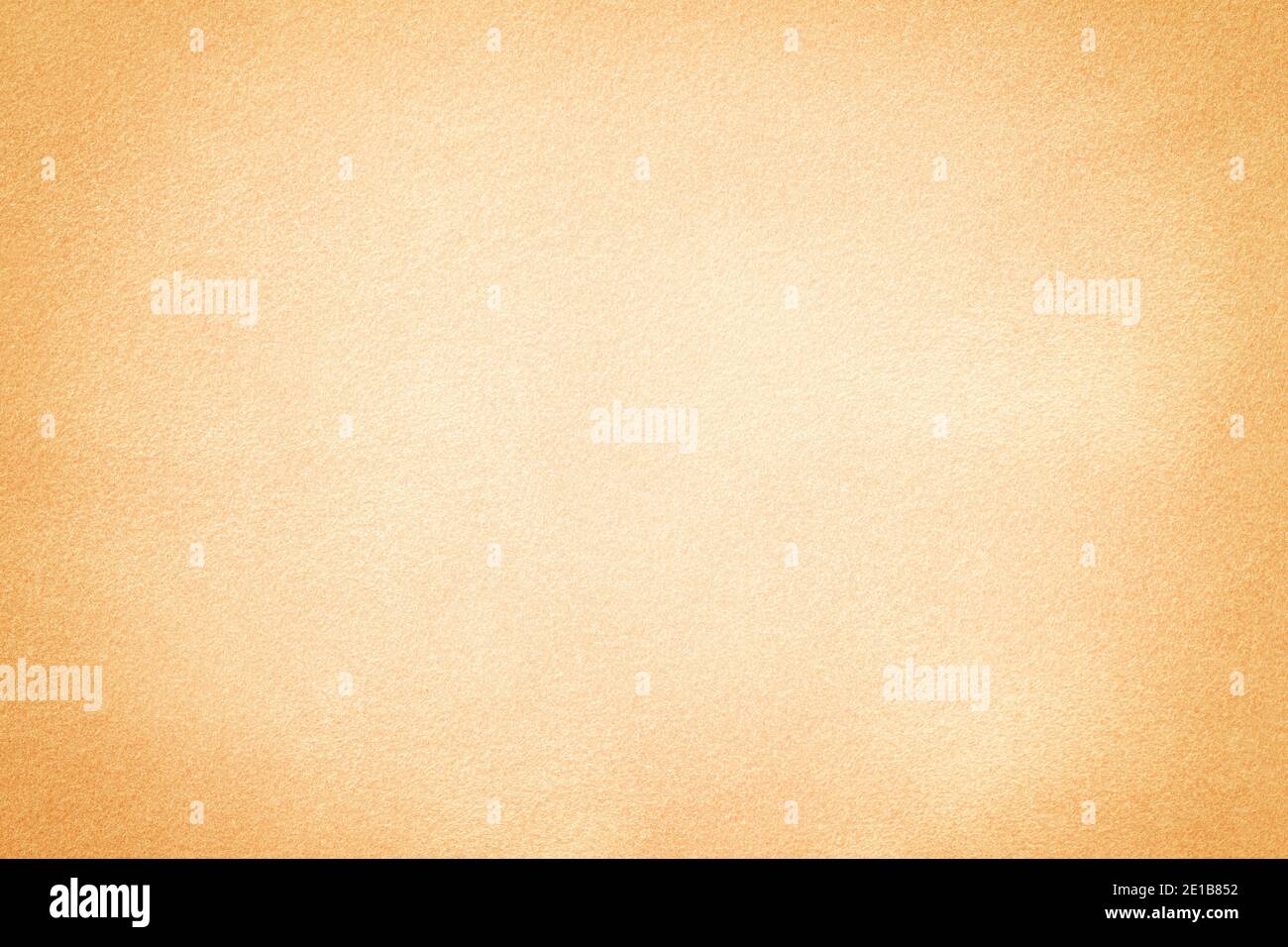 Light beige matte background of suede fabric with vignette, closeup ...