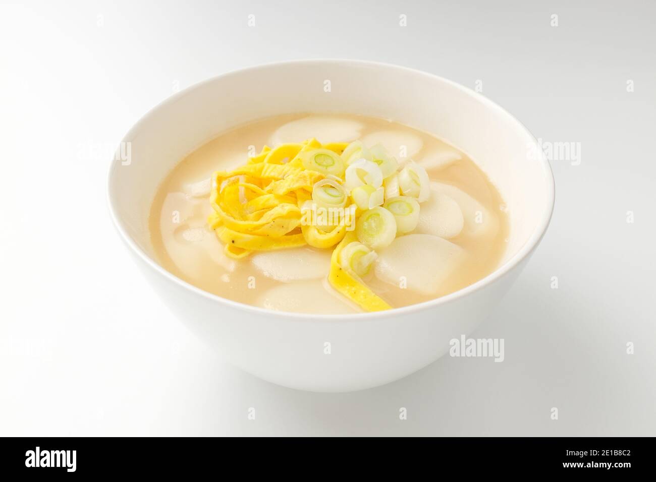Rice cake soup on a white background Stock Photo - Alamy