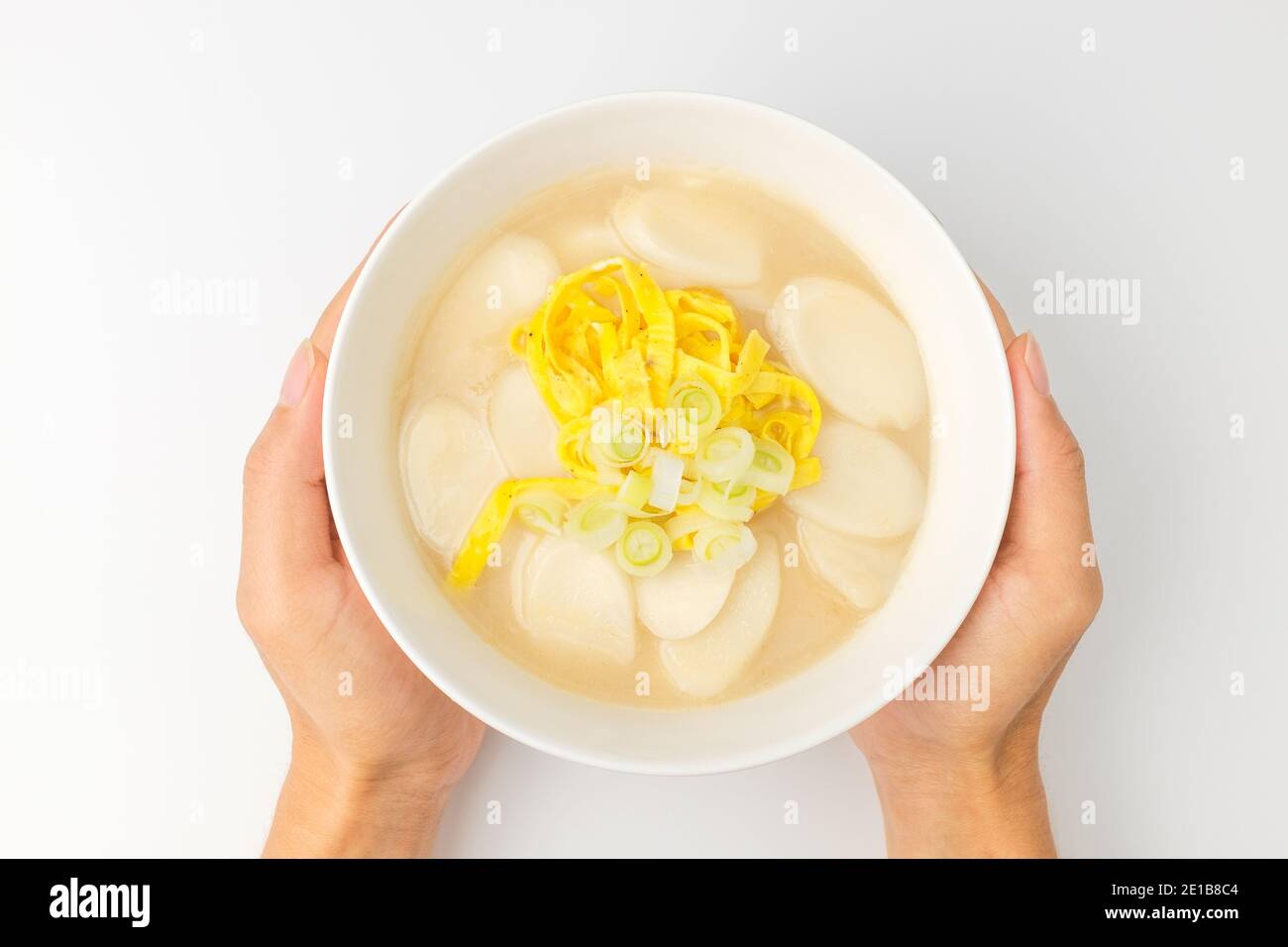 Rice cake soup on a white background Stock Photo - Alamy