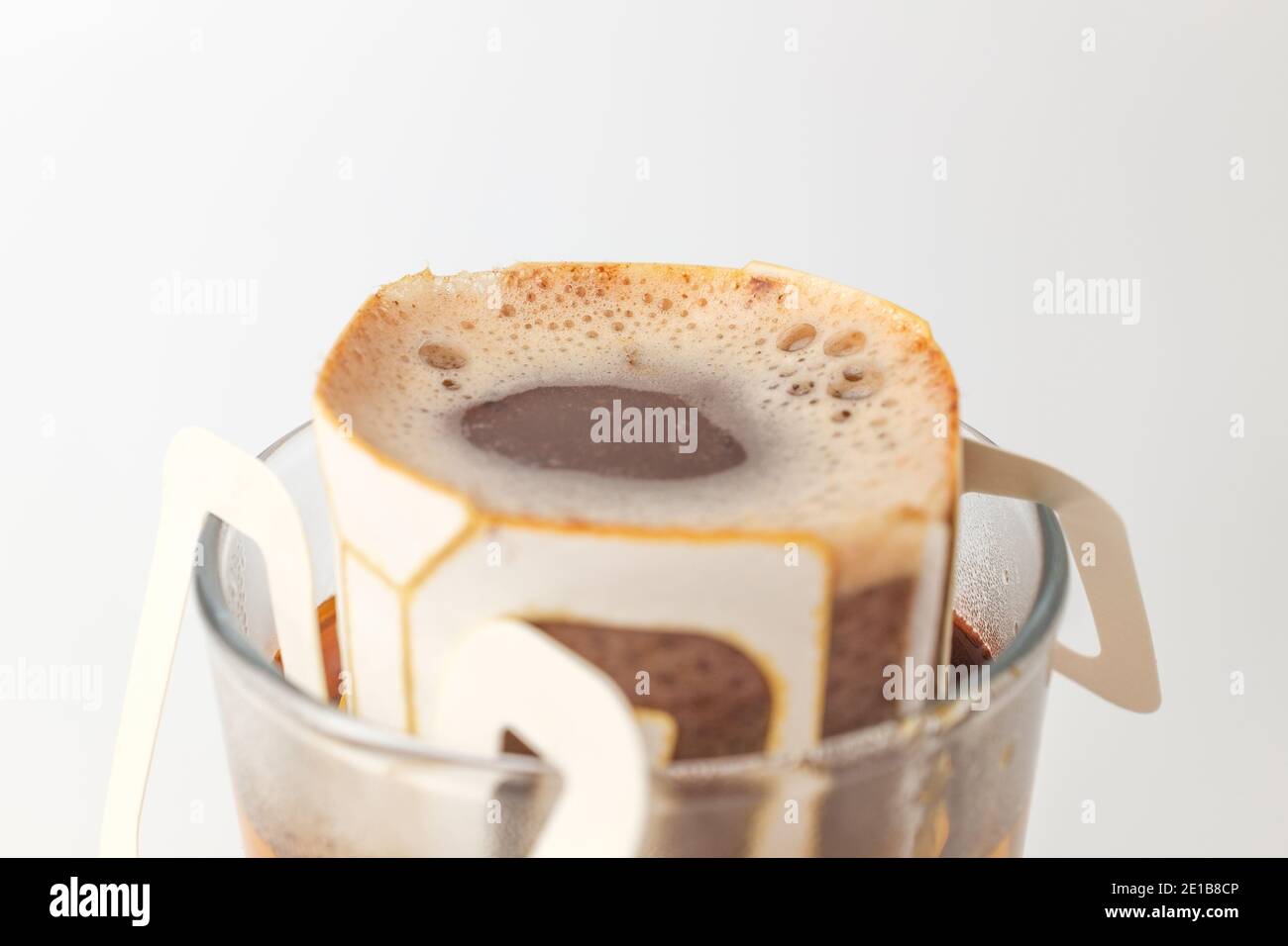 Drip bag coffee on white background Stock Photo - Alamy