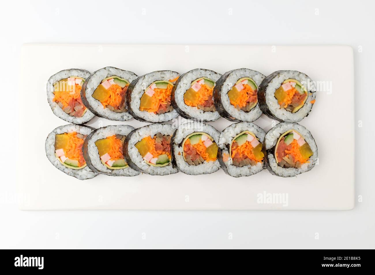 Gimbap with vegetables on white background Stock Photo - Alamy