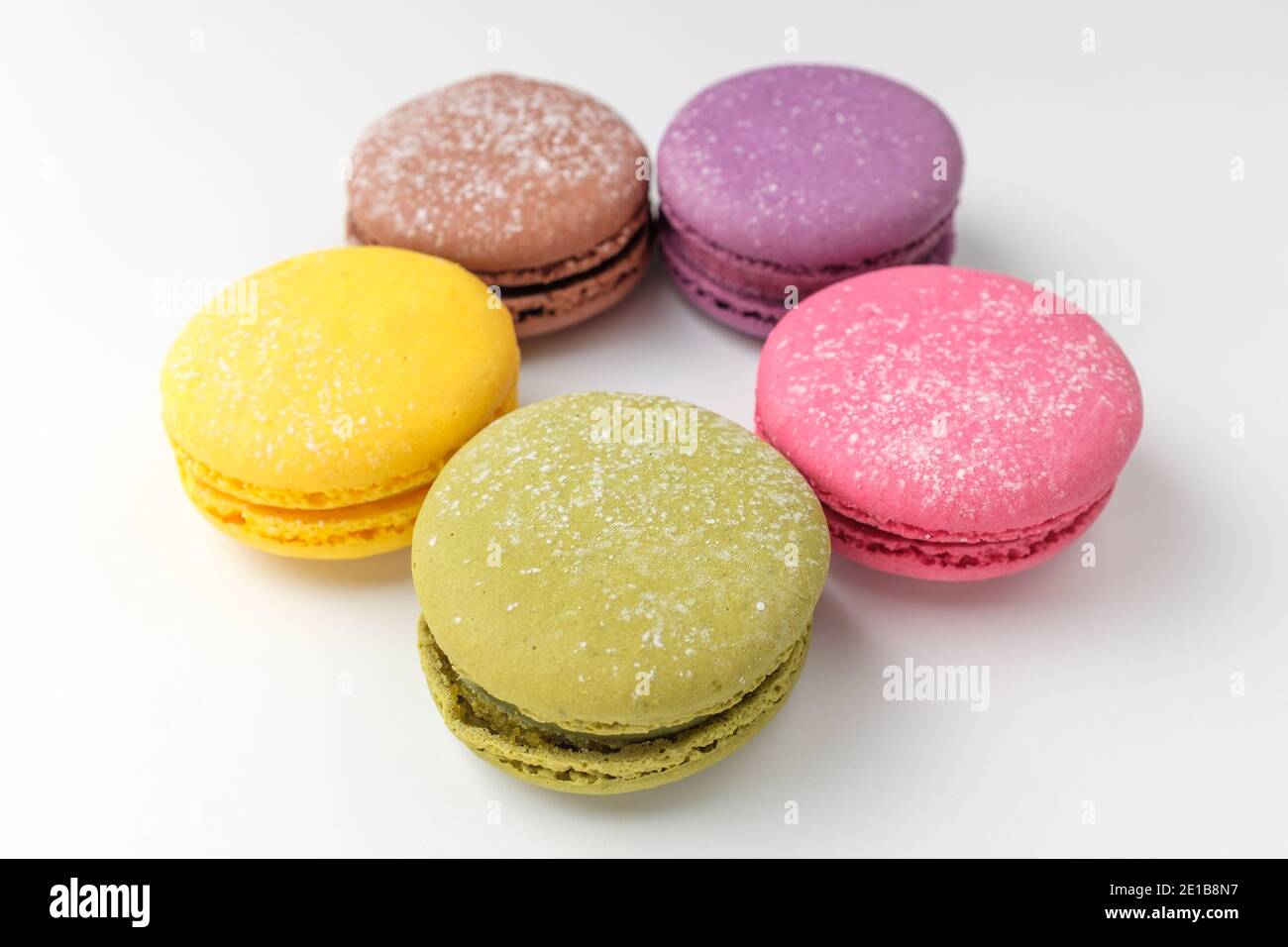 Colored macaroons on white background Stock Photo - Alamy