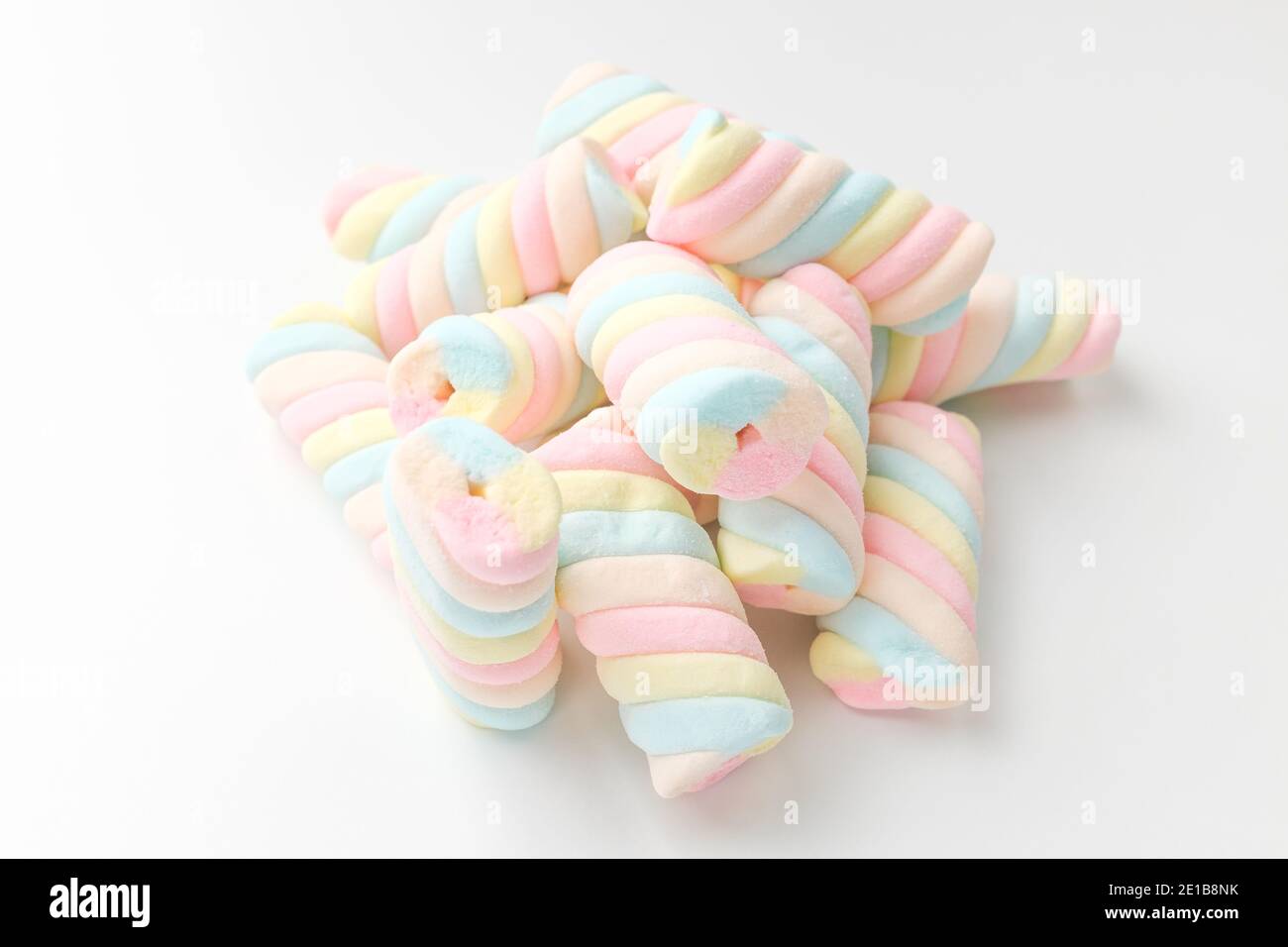 Colored marshmallows on a white background Stock Photo - Alamy
