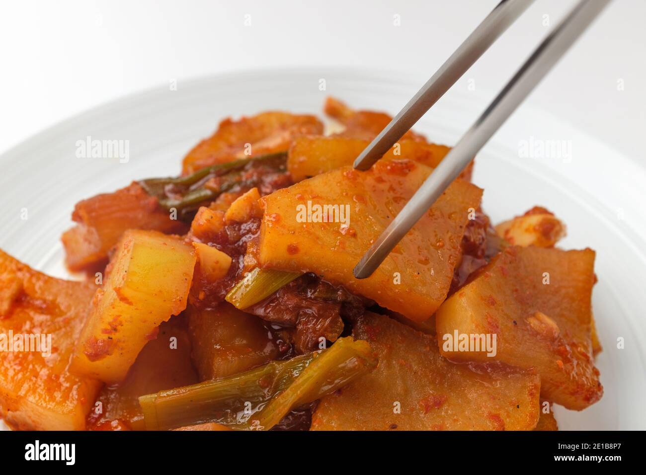 Boiled radish on a white background Stock Photo - Alamy
