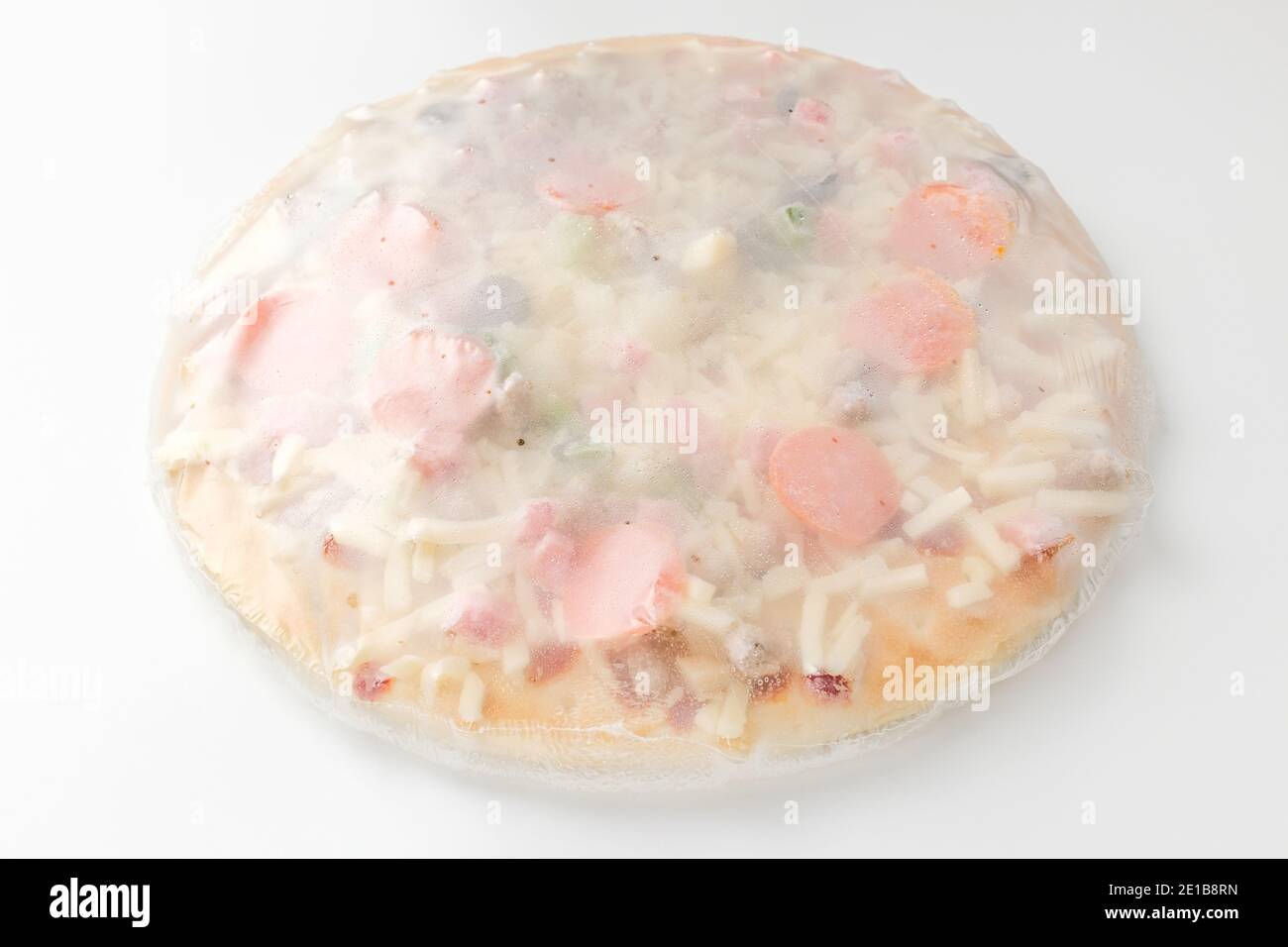 Frozen pizza on white background Stock Photo - Alamy