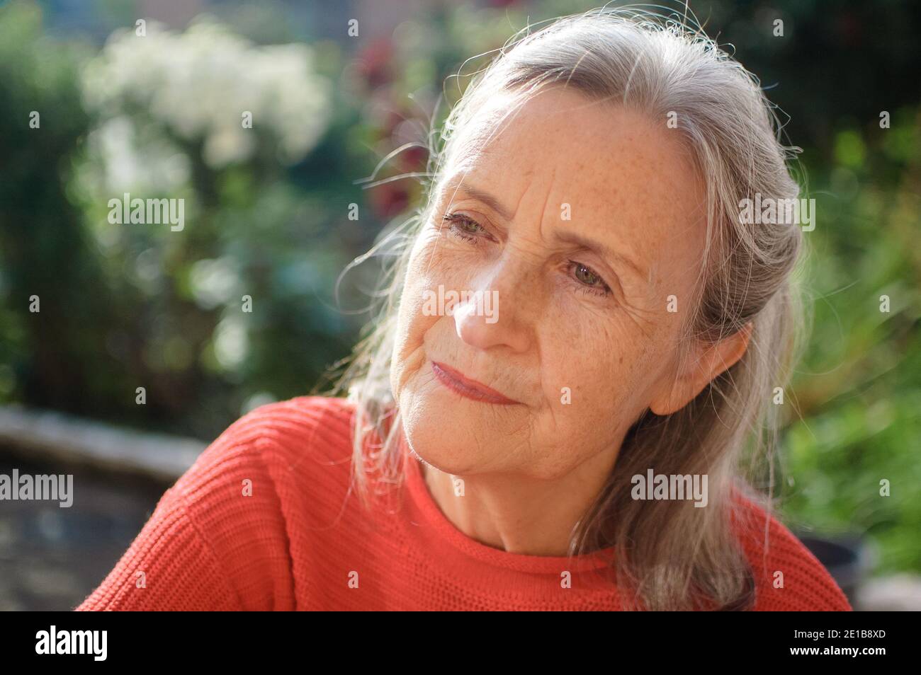 Beautiful old grandmother with grey hair and face with wrinkles ...