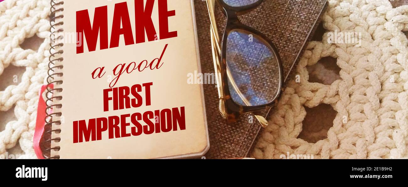 Make a Good First Impression written on book cover, eyeglasses and pen ...