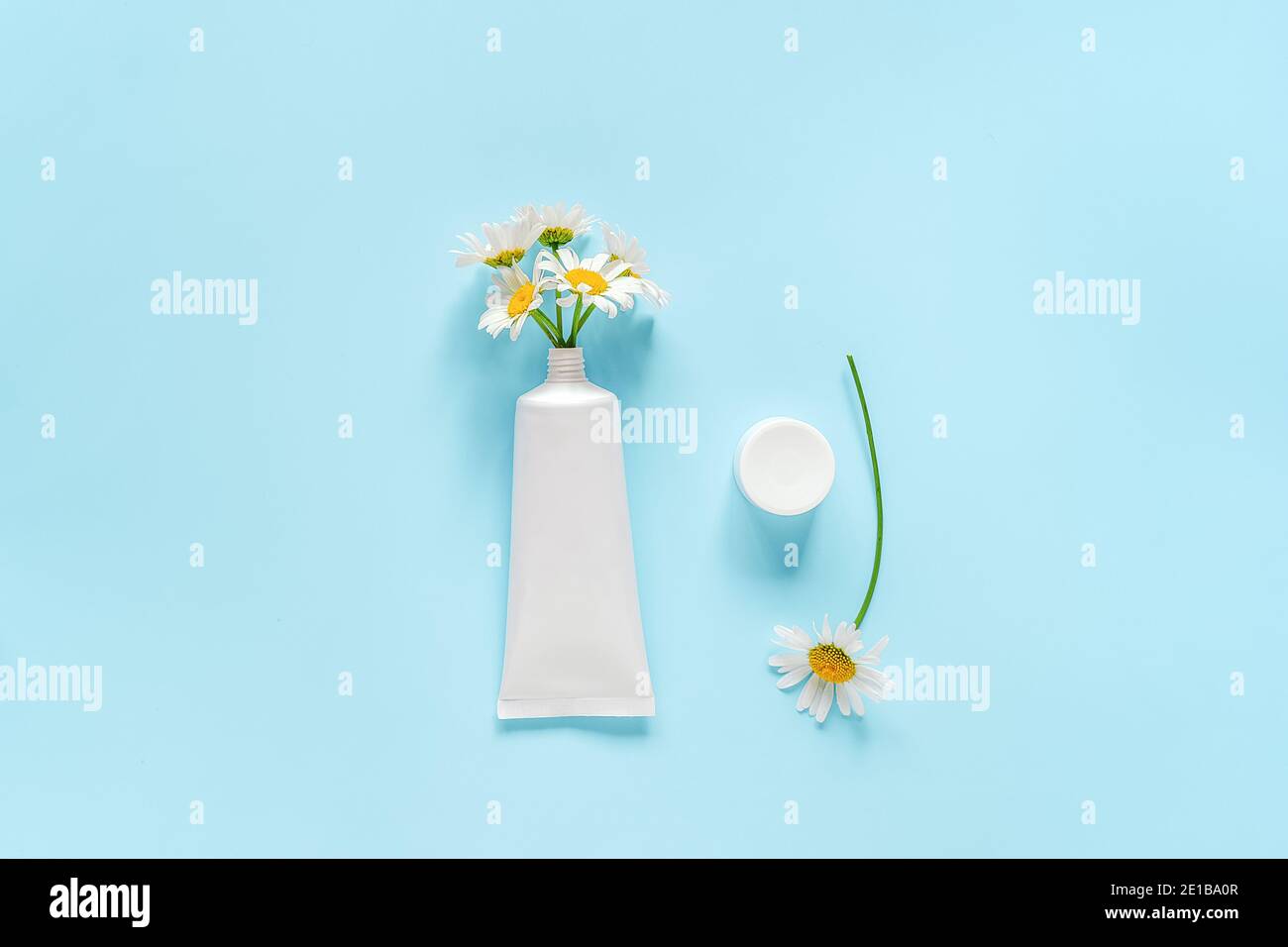 Bouquet of chamomile flowers from cosmetic, medical white tube for ...