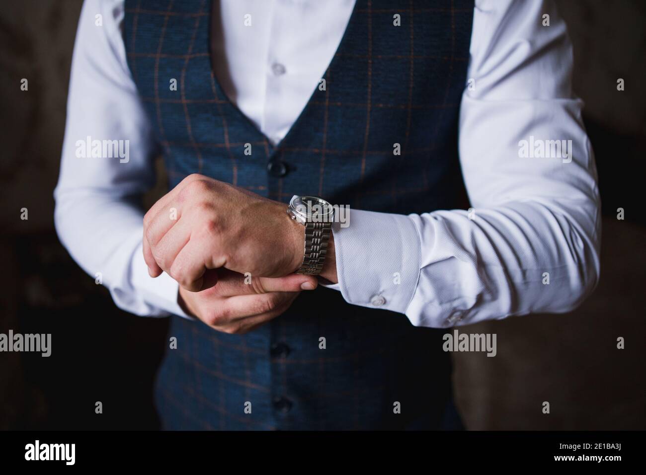 Man puts a watch hi-res stock photography and images - Alamy