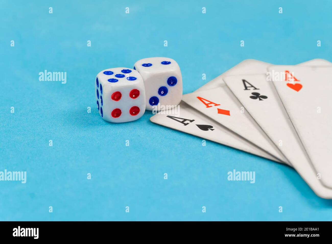 Four aces and two dice on a blue background with copy space Stock Photo ...