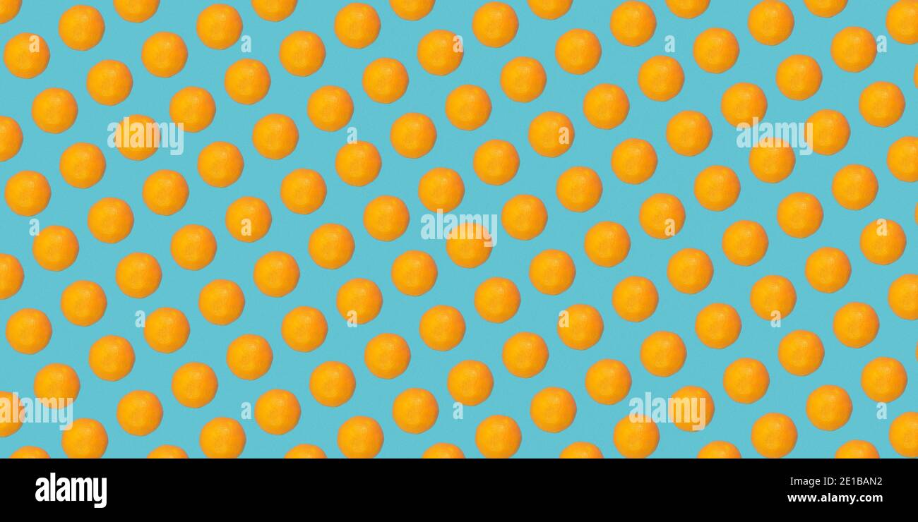 Seamless fruit pattern of fresh tangerines on a blue background. Print ...