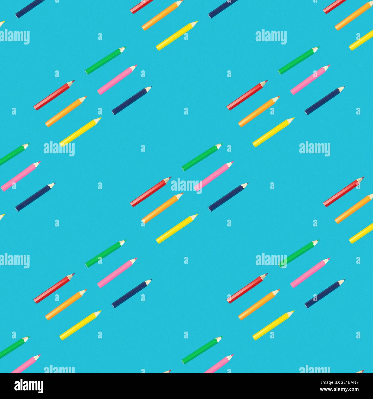 Seamless pattern of colored pencils on a blue background. Square ...