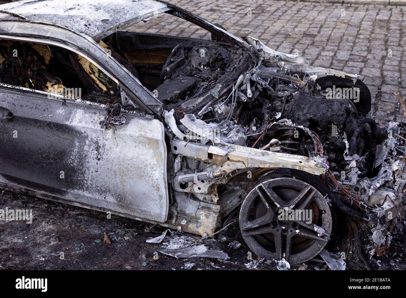 Burnt car close-up, side view with wheel. Car after the fire. Arson car ...