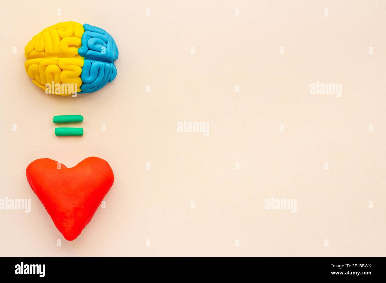 Think with love - heart and brain concept, top view Stock Photo - Alamy