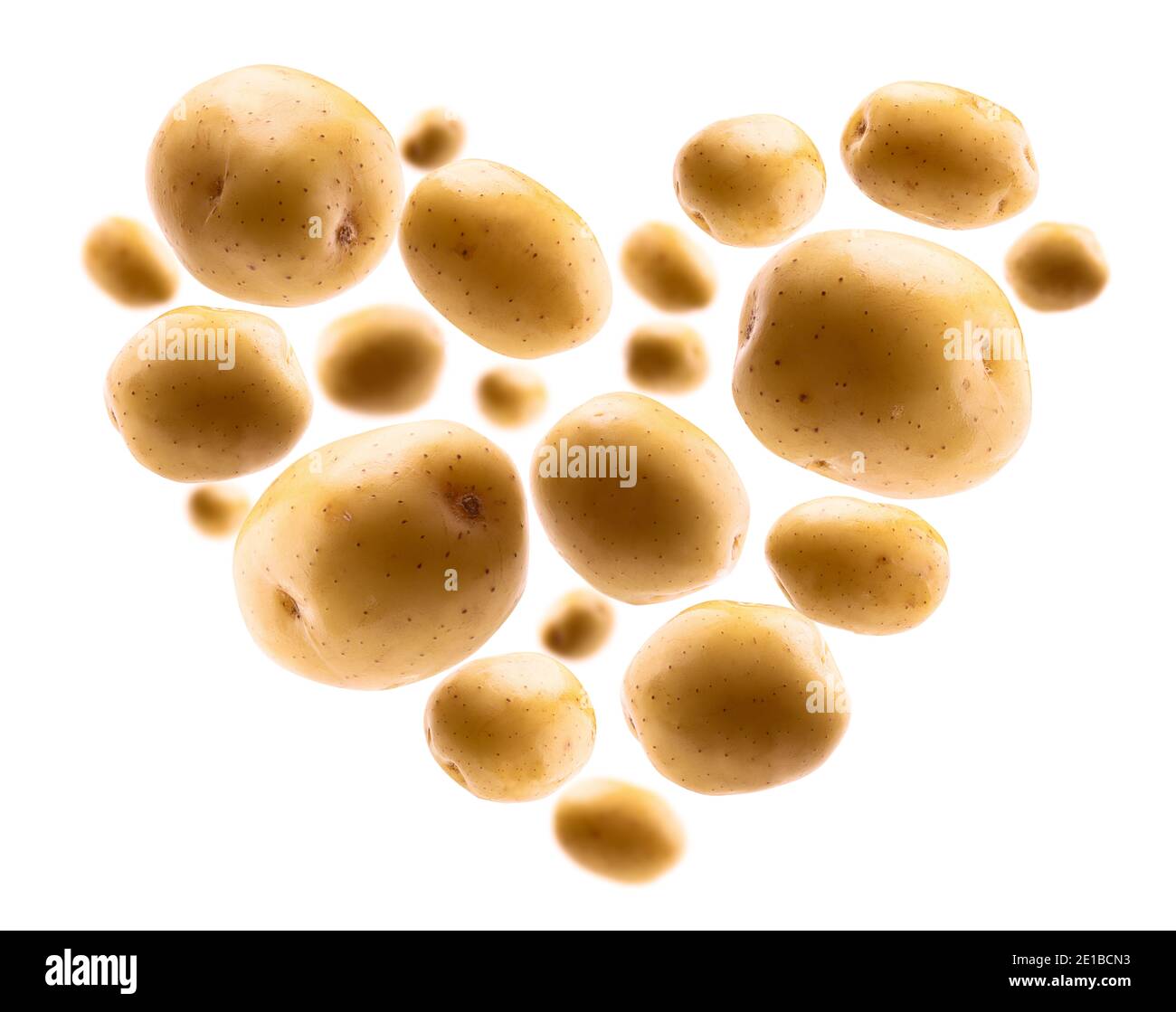 Whole heart - shaped potatoes on a white background Stock Photo - Alamy