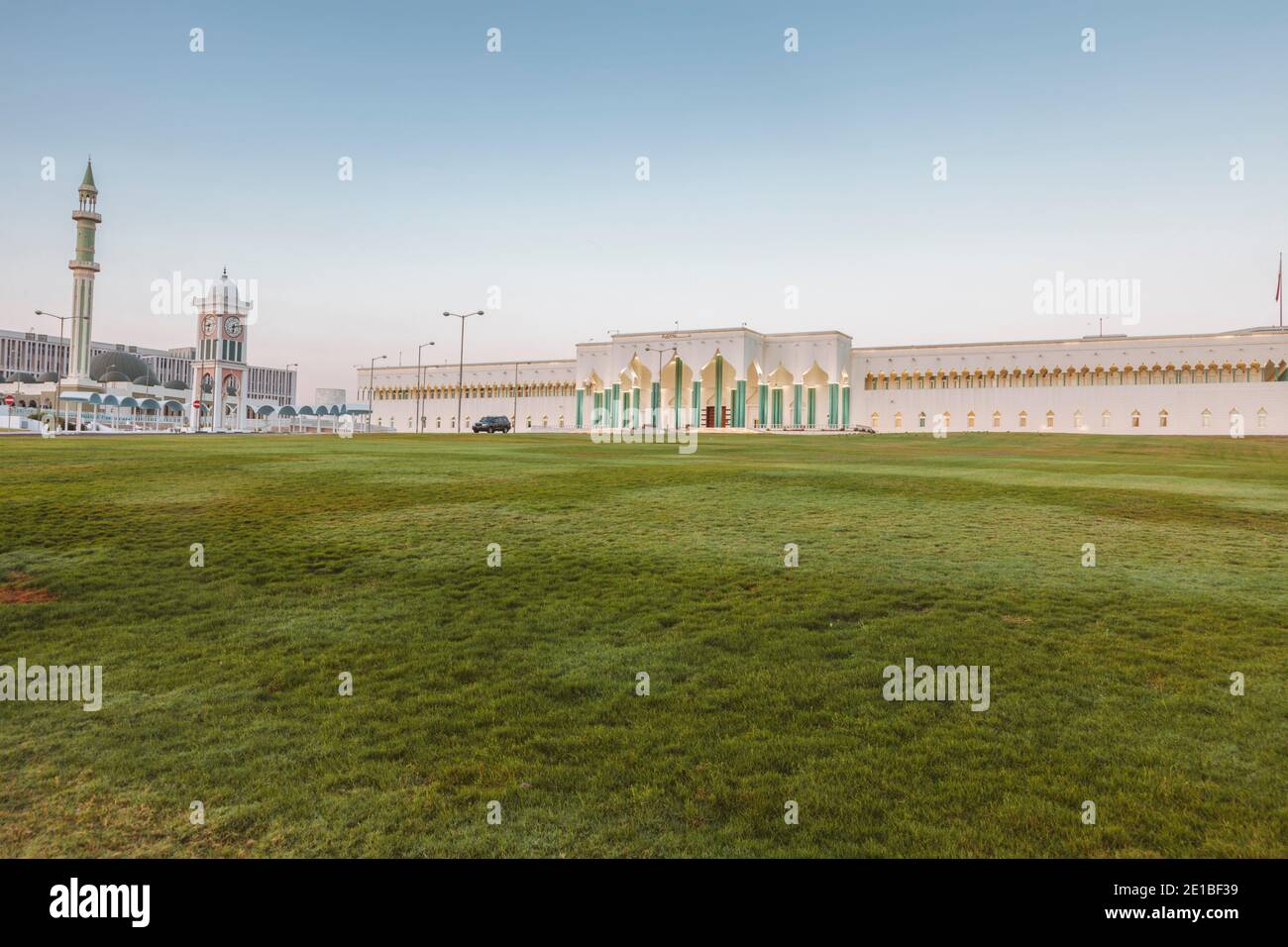 Amiri Diwan, Clock Tower and Mosque in Doha at sunset. Doha, Ad-Dawhah ...