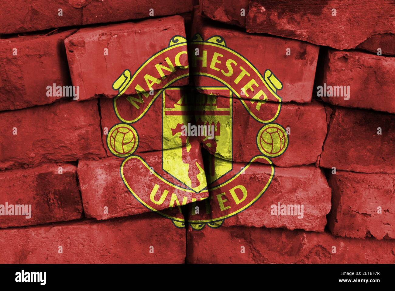 Manchester United Football Club flag painted on brick wall Stock Photo ...