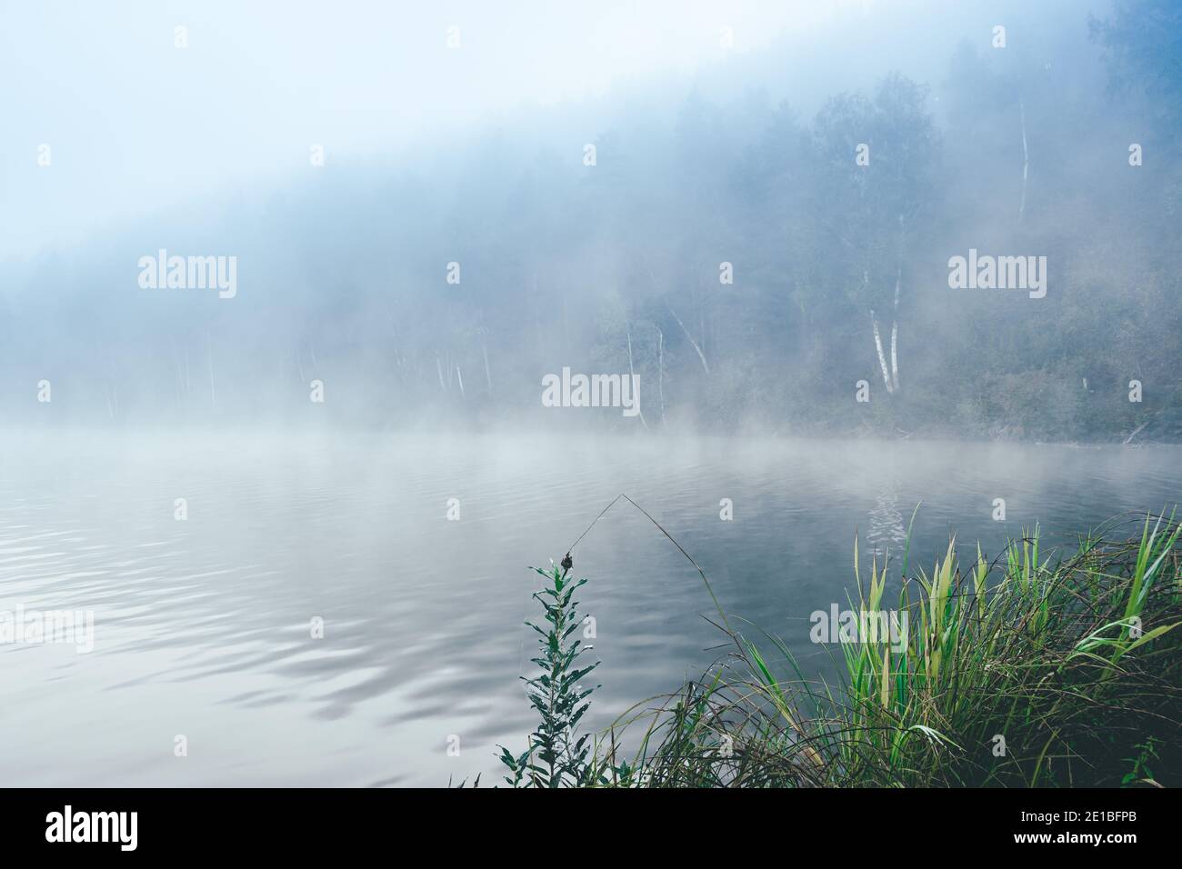Fog over mirror surface lake hi-res stock photography and images - Alamy