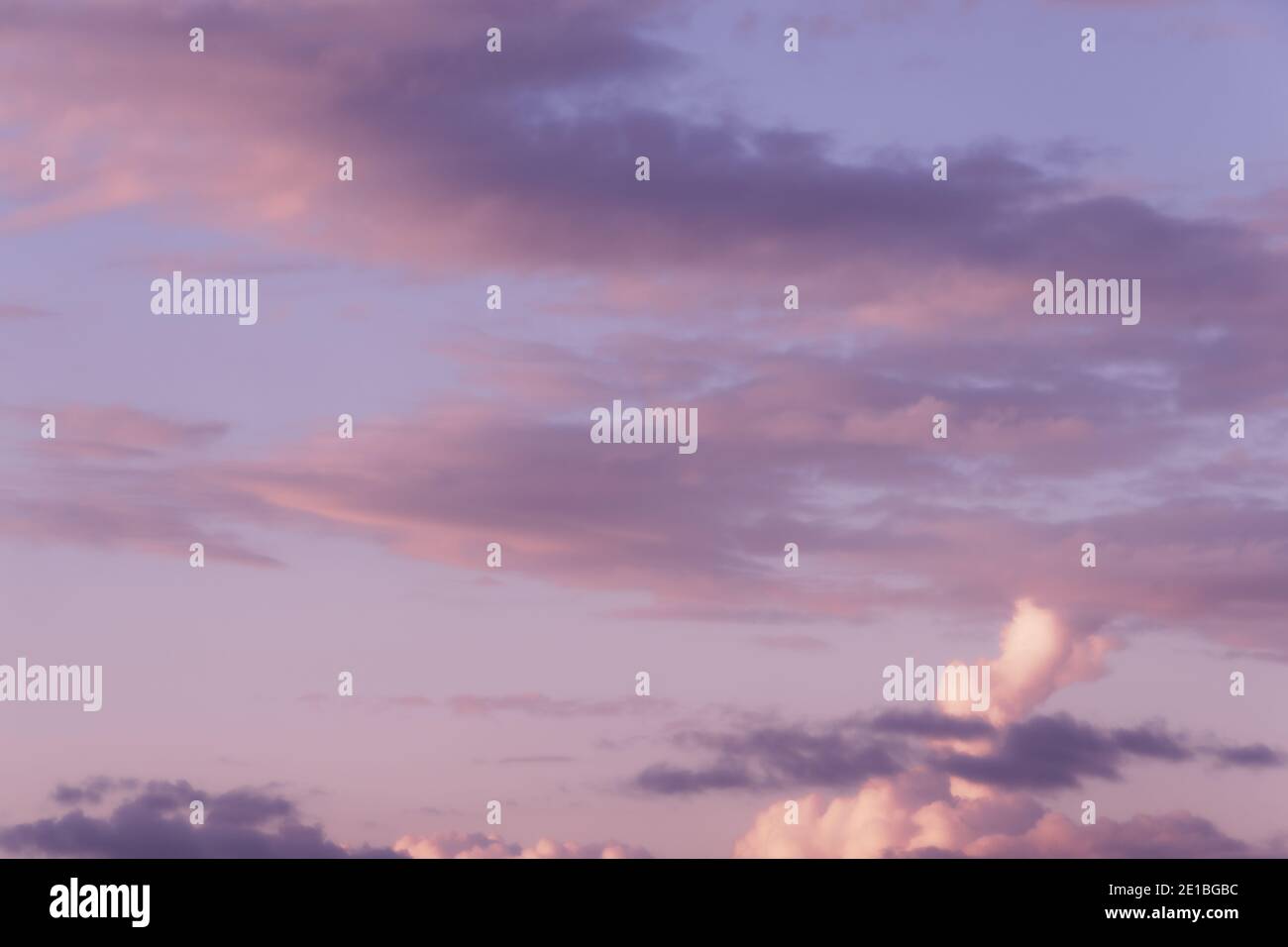 Soft pink clouds in sunset sky Stock Photo - Alamy